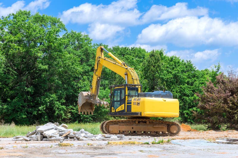 Backhoe Excavator Scoop Loading from Building the Construction Debris ...