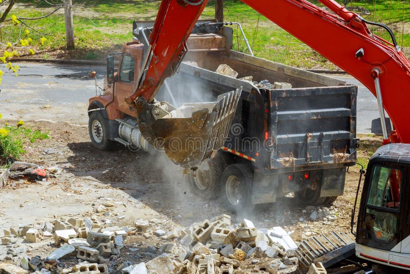 Backhoe Excavator Scoop Loading from Building in the Construction ...