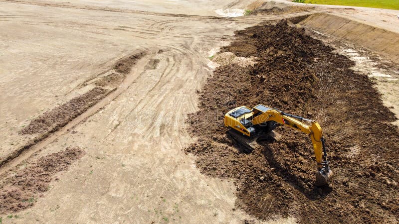 Backhoe or Excavator Scraping a Layer of Soil Stock Photo - Image of ...
