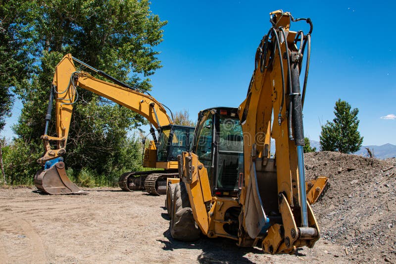 Backhoe and Excavator editorial stock image. Image of tractor - 283904139