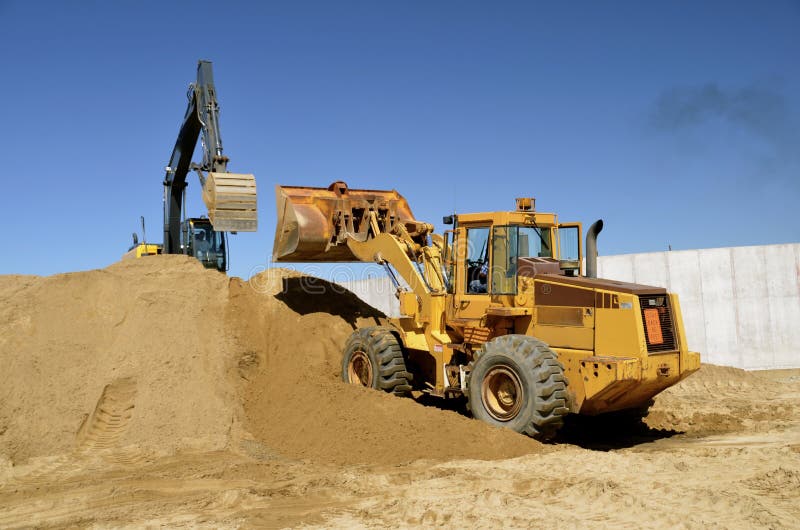 Backhoe and Front End Loader Moving Sand Stock Photo - Image of scoop ...