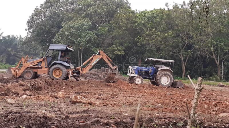 Backhoe loader doing work stock video. Video of machine - 158920297