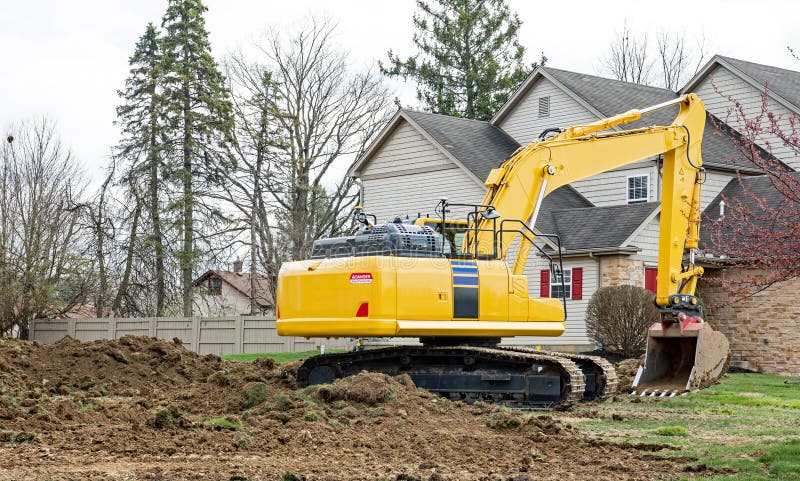 Backhoe Loader Excavating Land Area Stock Photo - Image of backhoe ...