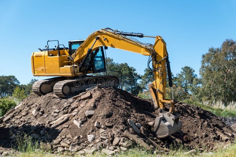 Backhoe Operation: Moving Gravel To the Ccrusher Stock Photo - Image of ...