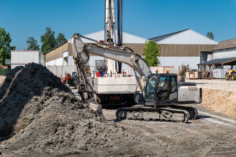 Backhoe Loader Warming Up To Prepare Foundations for Residential ...