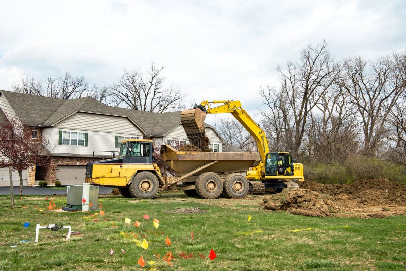 Backhoe Loading Excavated Soil into Truck Stock Image - Image of ...