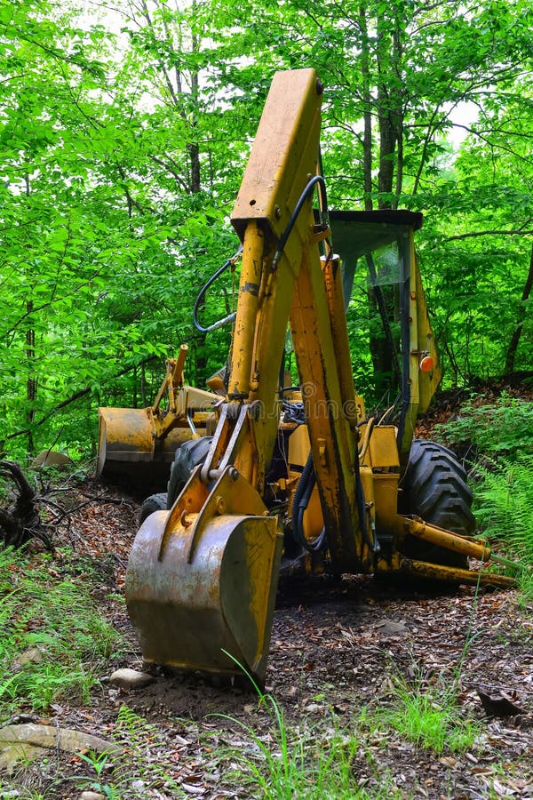 Backhoe Parked in Wilderness Stock Photo - Image of used, trees: 56037722