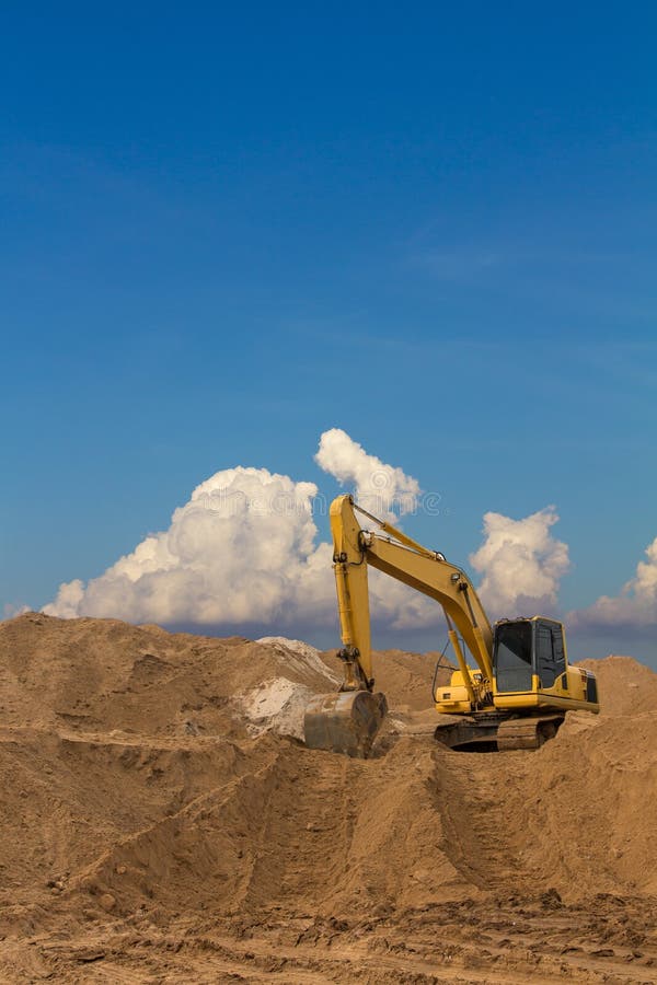 Backhoe on the Sand Cloud Sky. Stock Photo - Image of engineering ...