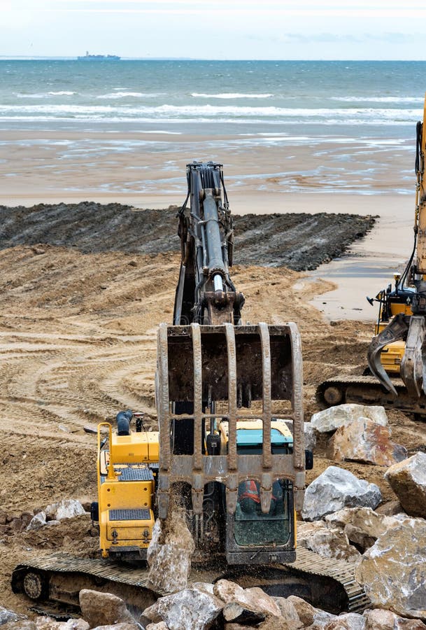 Large Hydraulic Excavator in Action on a Construction Site Close-up ...