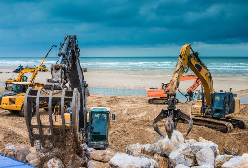 Large Hydraulic Excavators Working As a Team on a Construction Site ...