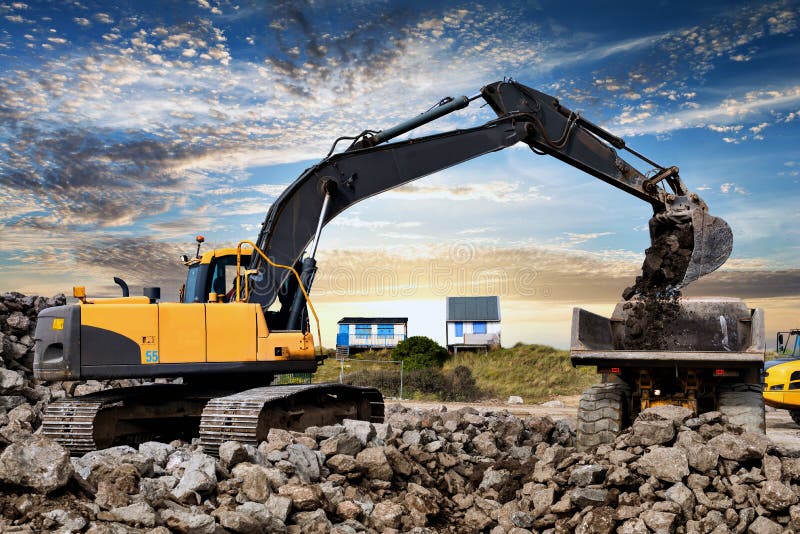 Large Hydraulic Excavators Working As a Team on a Construction Site ...