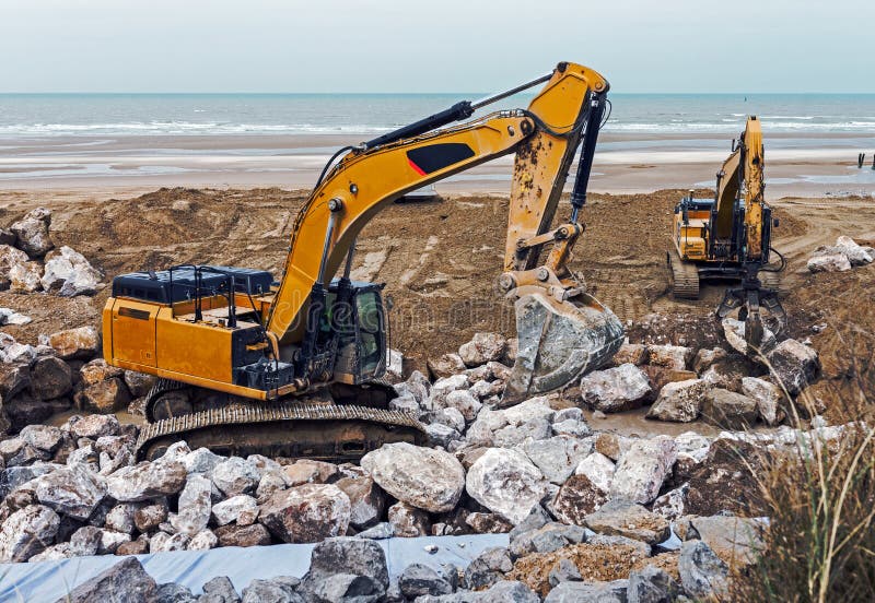 Large Hydraulic Excavators Working As a Team on a Construction Site ...