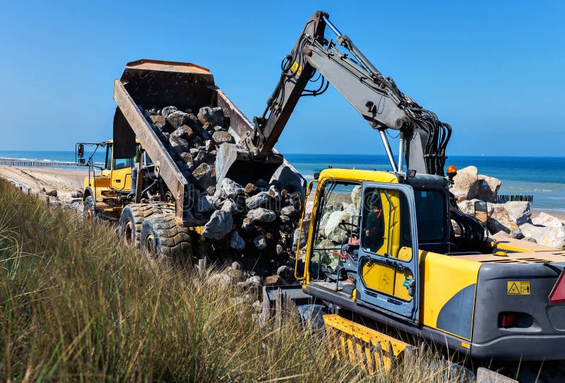 Large Hydraulic Excavators Working As a Team on a Construction Site ...