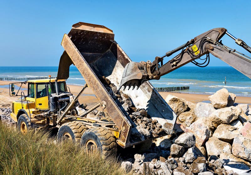 Large Hydraulic Excavators Working As a Team on a Construction Site ...