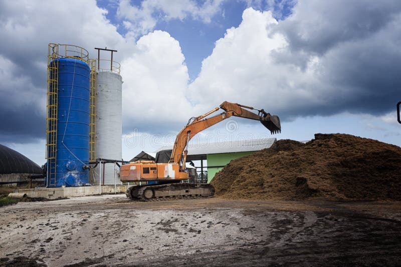 Backhoe Working on Garbage Dump in Landfill. People Working at Landfill ...
