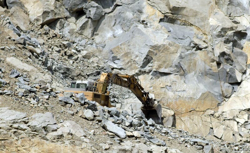 Backhoe working in quarry stock image. Image of machine - 44439997