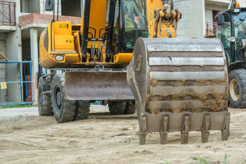 Backhoes Standing at Construction Site Stock Image - Image of ...