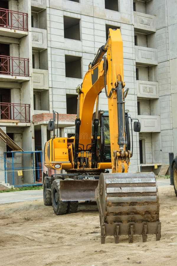 Backhoes Standing at Construction Site Stock Photo - Image of loader ...