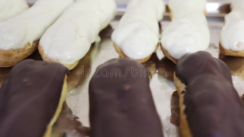 Backing Sheet with Eclairs with Chocolate and Stock Video - Video of ...