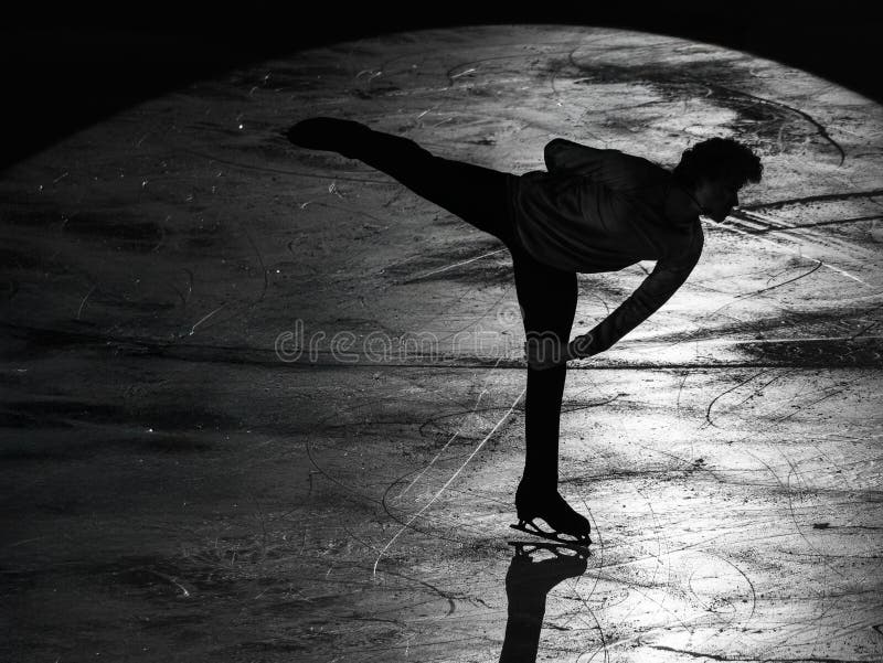 Backlight of an Athlete Skater and the Shadow Reflected on the Ice Rink ...
