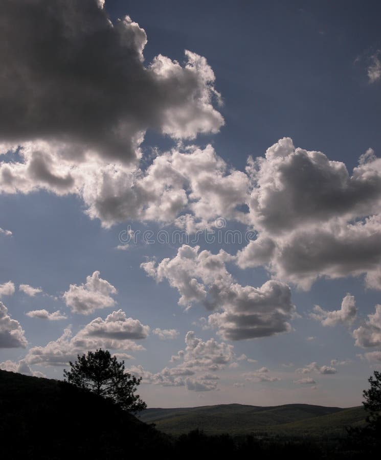 Backlit Clouds with Trees and Hills Stock Photo - Image of landscape ...