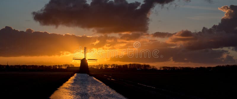 Backlit Dutch Windmill during Sunrise Stock Image - Image of ...