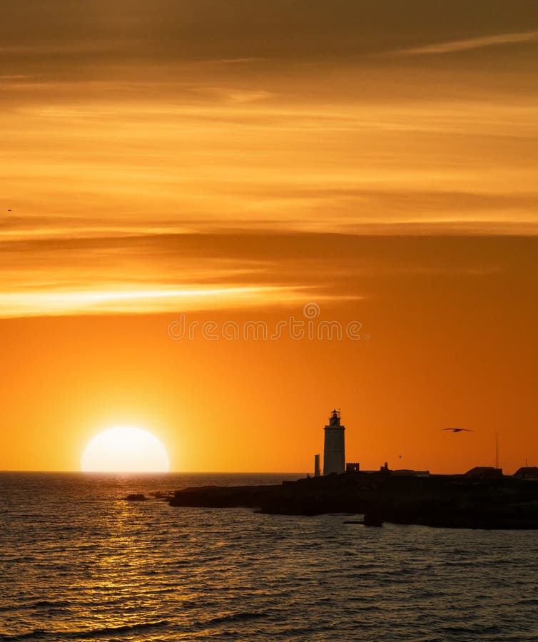 Lighthouse at Sunset with Sun Over the Oce Stock Image - Image of ...