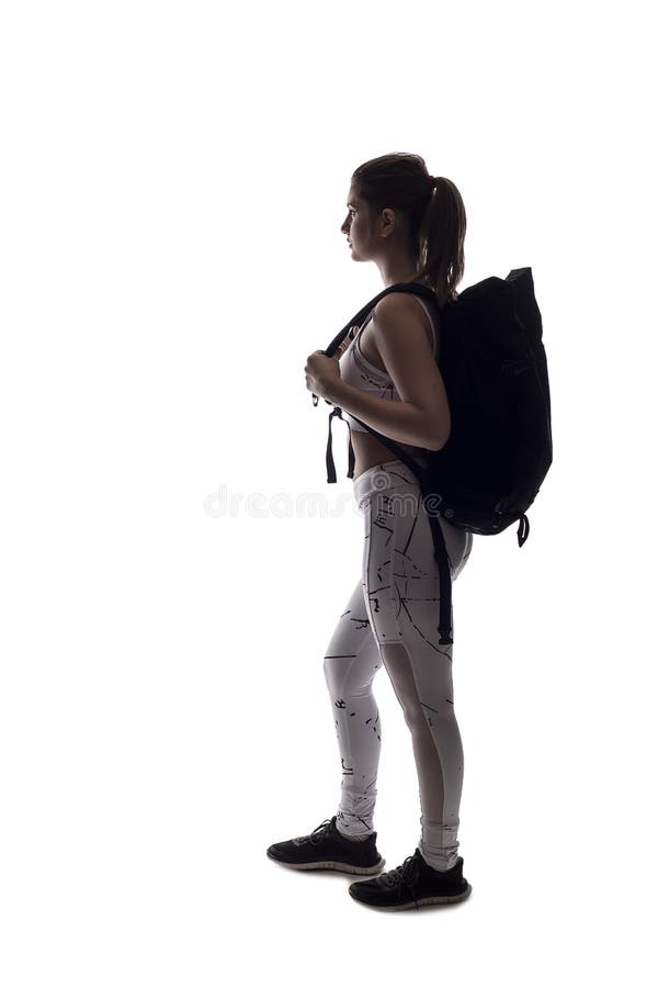 Backlit Model Posing As a Hiker or Backpacker on a White Background for ...