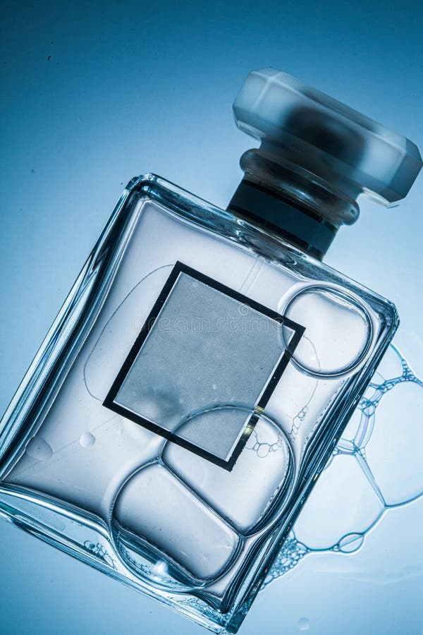 Backlit Perfume Bottle Shot in Studio Stock Photo - Image of cold ...