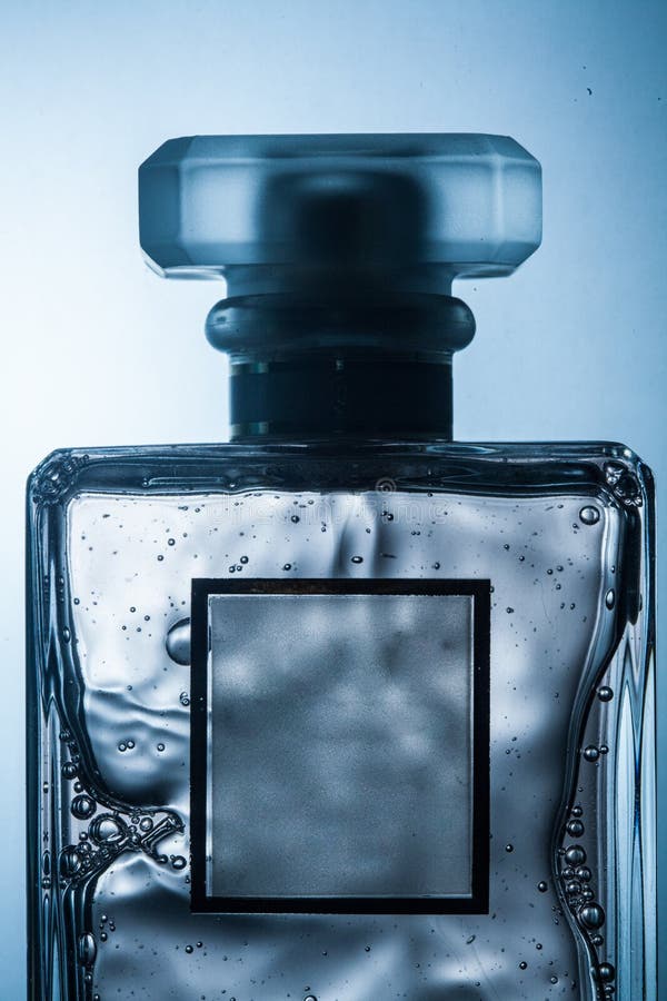 Backlit Perfume Bottle Shot in Studio Stock Photo - Image of looks ...