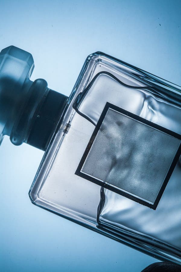 Backlit Perfume Bottle Shot in Studio Stock Photo - Image of blue ...