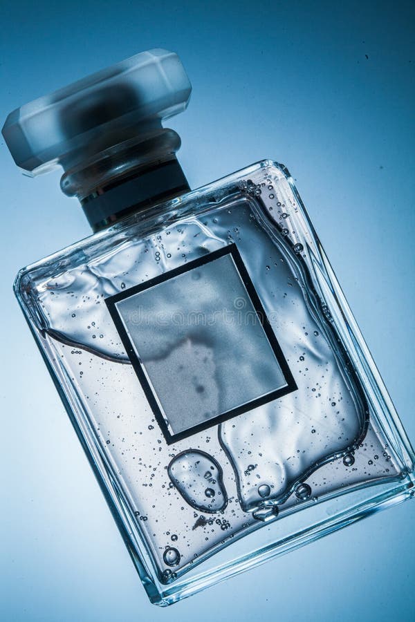 Backlit Perfume Bottle Shot in Studio Stock Photo - Image of looks ...