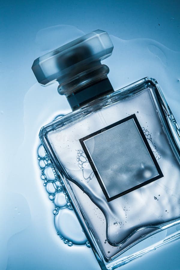Backlit Perfume Bottle Shot in Studio Stock Photo - Image of shot ...