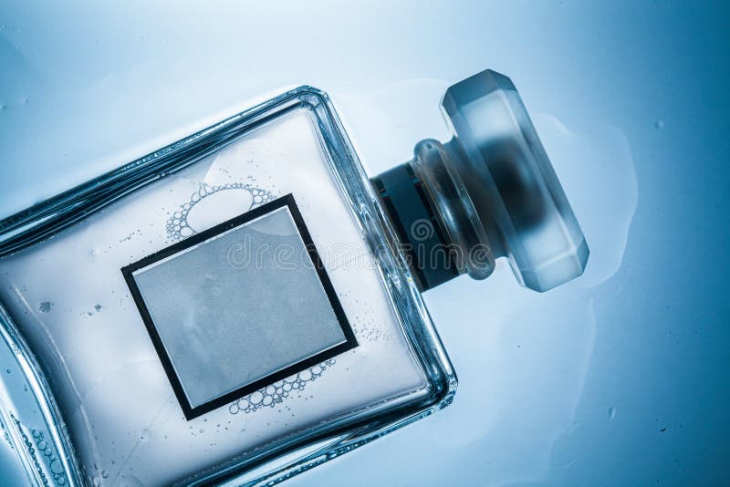 Backlit Perfume Bottle Shot in Studio Stock Photo - Image of liquid ...