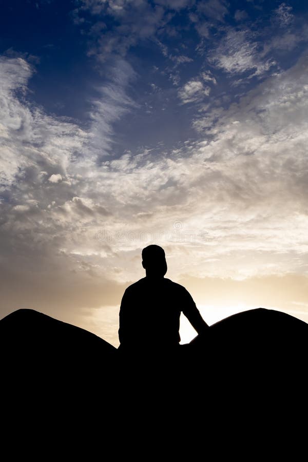 Backlit Shot of Isolated Man Meditating at Wall with Sunset Dramatic ...