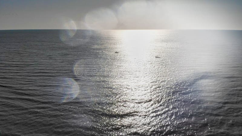 Backlit View of Ocean at Sunset from Drone Stock Photo - Image of ...