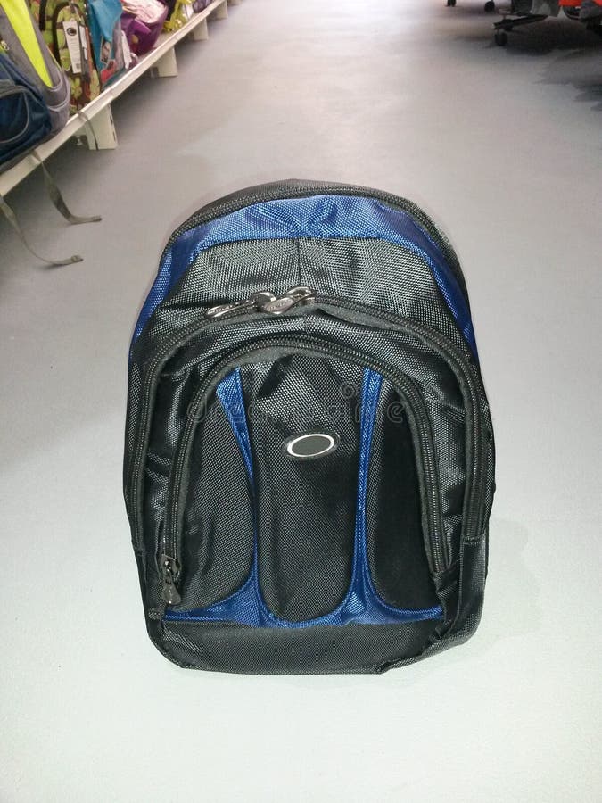 Backpack Black-blue on the Ground in Backpacks and Clothes Store Stock ...