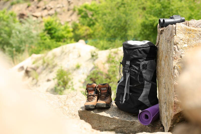 Backpack and Camping on Rocks in Wilderness. Space for Text Stock Photo ...