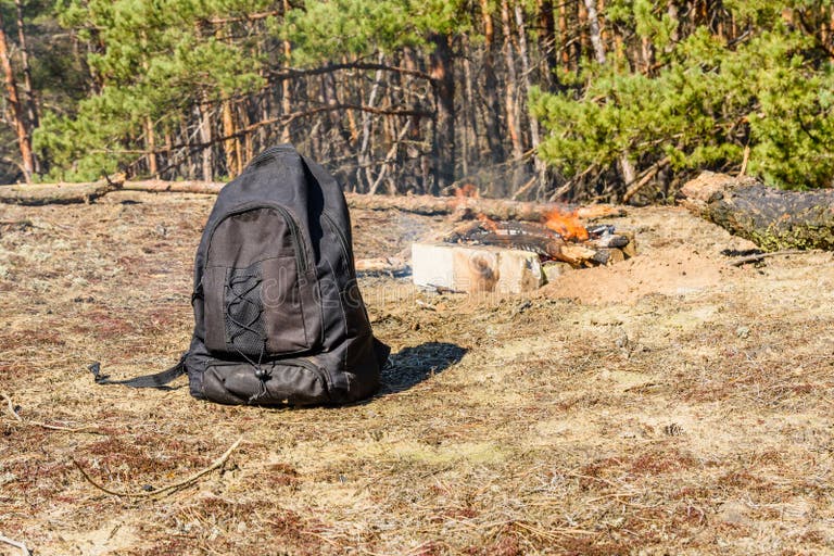 Backpack, Touristic Boots, Map, Compass and Hat on a Ground in a ...