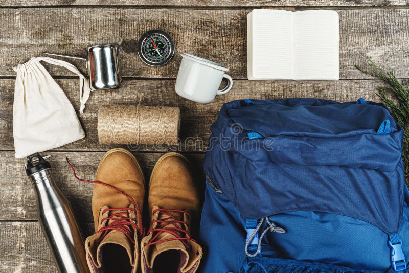 Backpack and Hiking Equipment on Wooden Background, Top View Stock ...