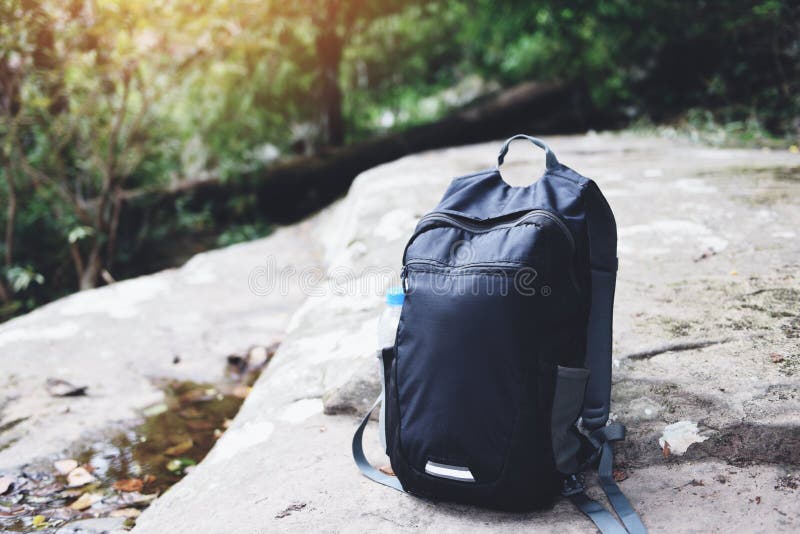 Backpack on Nature with Bottle for Backpacker Hiker on the Rock in the ...
