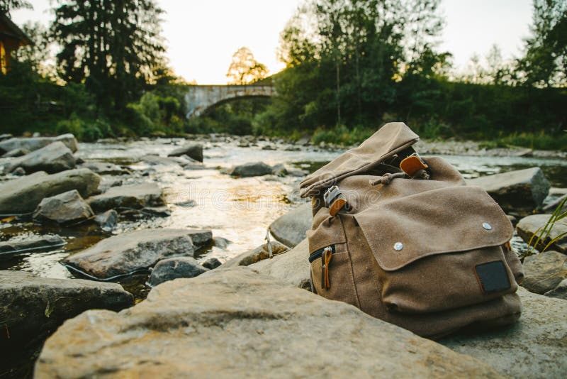 Backpack Near Mountains River Stock Photo - Image of relax, landscape ...