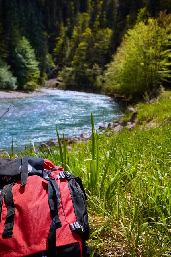 Backpack over stream stock image. Image of trek, stream - 72018159