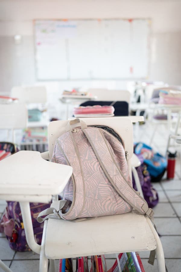 Backpack Resting on Chair in Empty Classroom during Break Time Stock ...