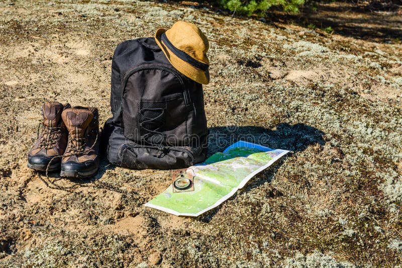 Backpack, Touristic Boots, Map, Compass and Hat on a Ground Stock Photo ...