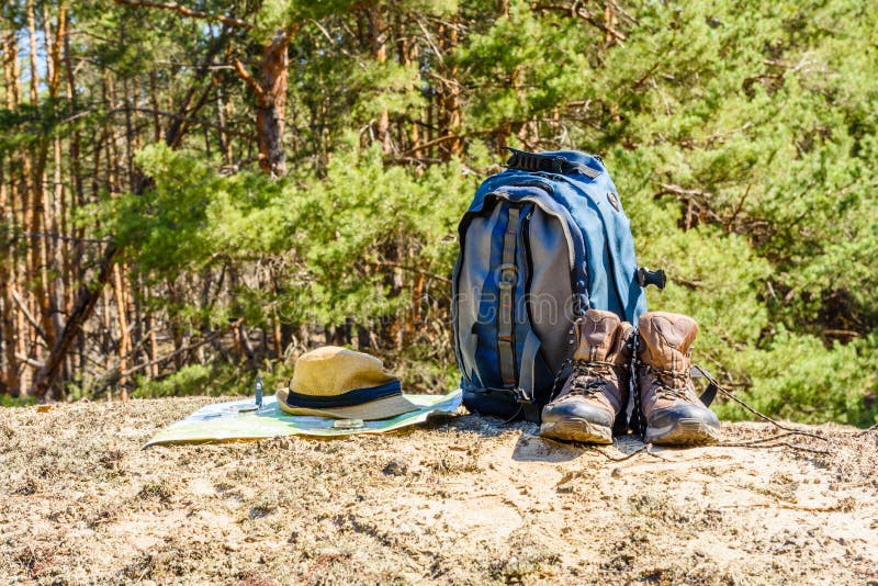 Backpack, Touristic Boots, Map, Compass and Hat on a Ground in a ...