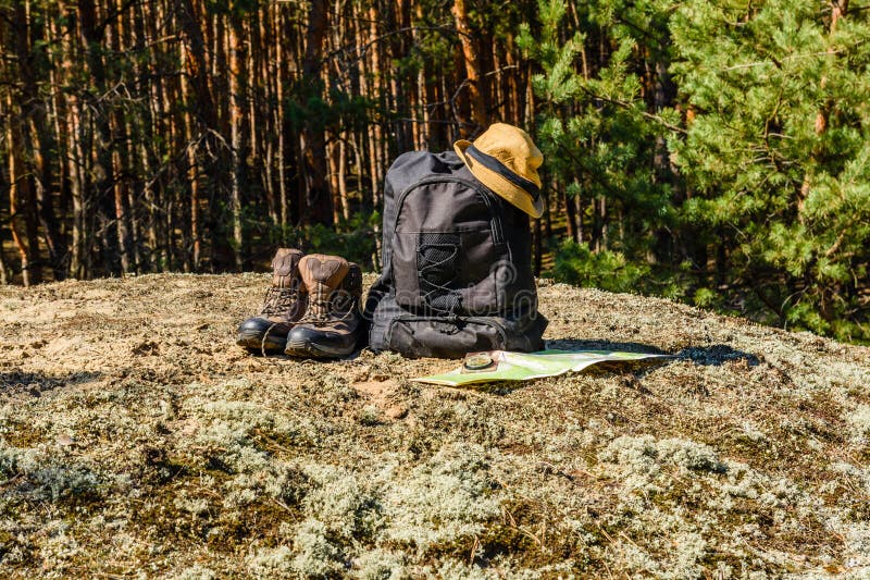 Backpack, Touristic Boots, Map, Compass and Hat on a Ground in a ...