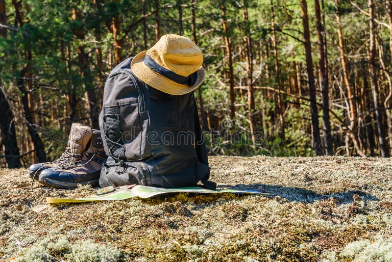 Backpack, Touristic Boots, Map, Compass and Hat on a Ground in a ...