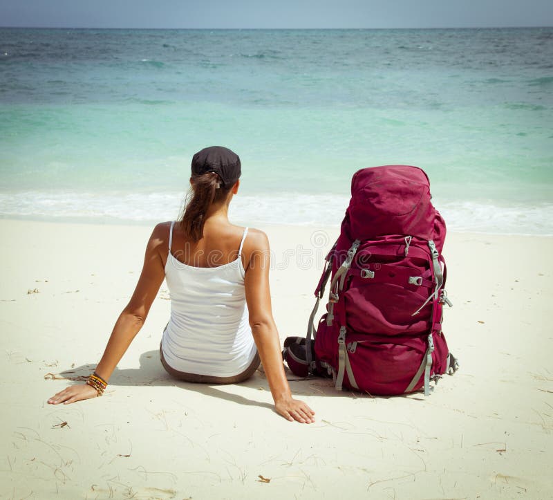 Backpacker on beach stock photo. Image of summer, sitting - 26758254