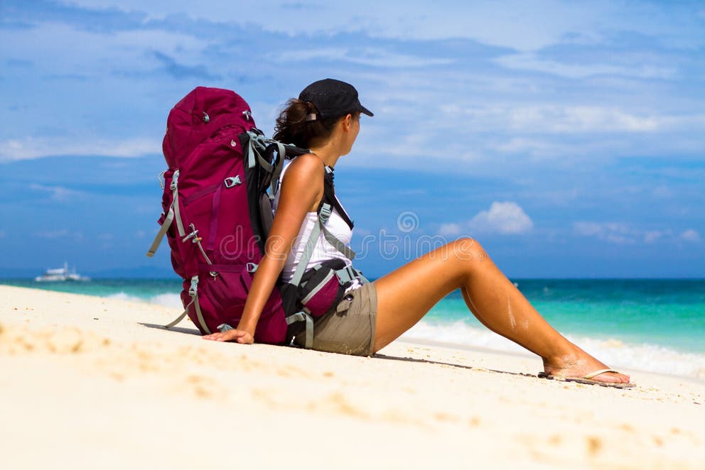 Backpacker on beach stock image. Image of relaxing, sitting - 26758301